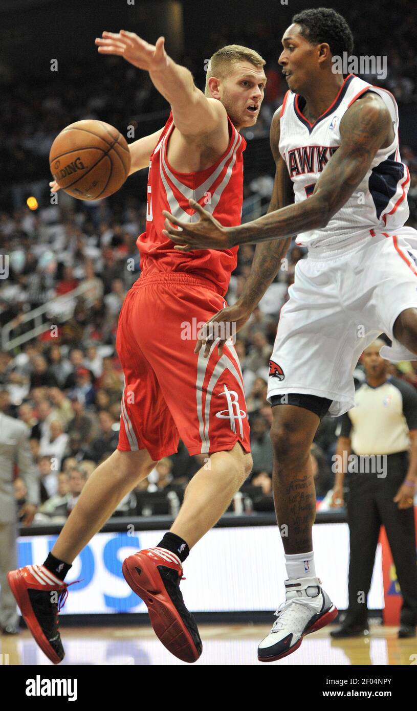 The Atlanta Hawks' Louis Williams (3) passes around Houston Rockets ...