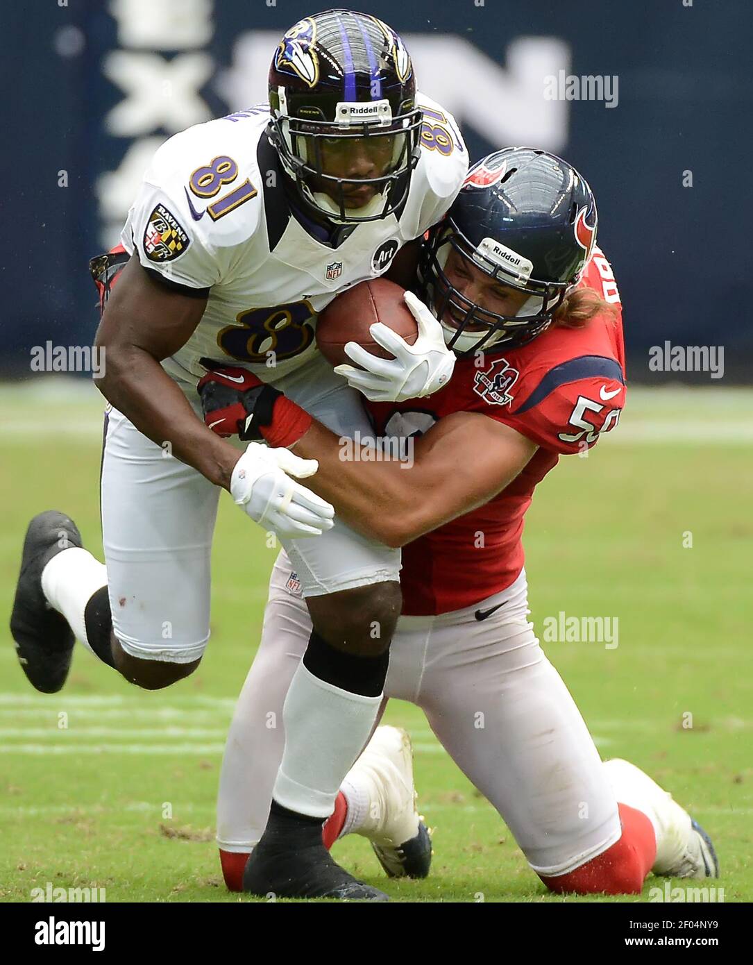 Wide receiver Anquan Boldin (81) of the Baltimore Ravens is tackled by ...