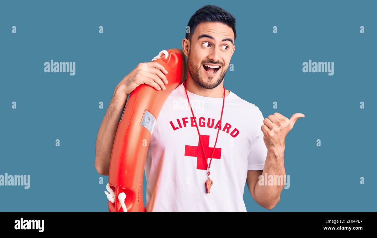 Male lifeguard smiling holding hi-res stock photography and images - Alamy