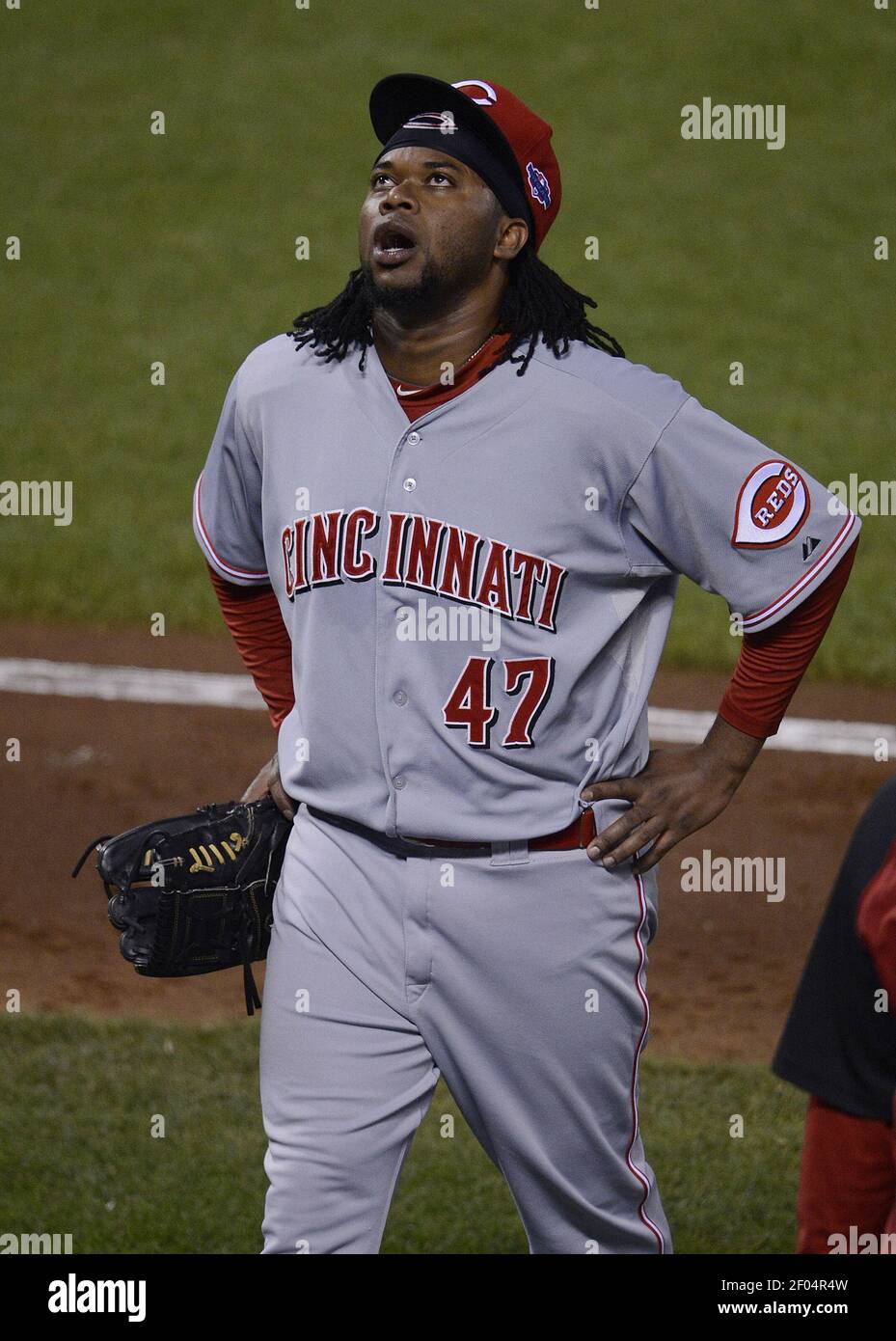 Cincinnati Reds starting pitcher Johnny Cueto (47) tosses the ball to ...
