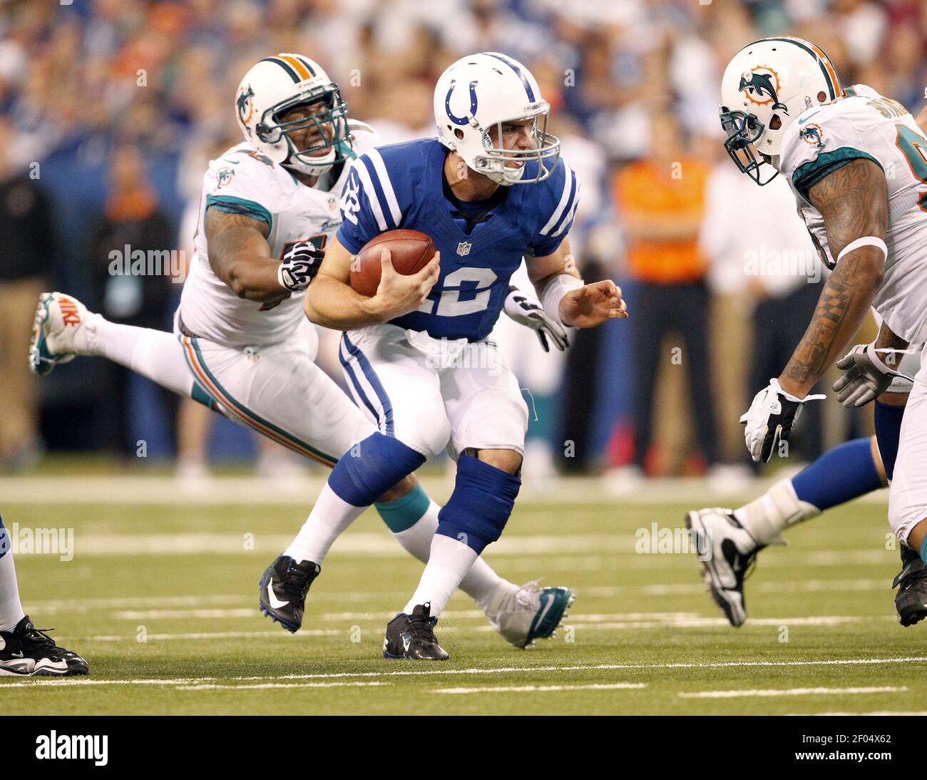 Indianapolis Colts quarterback Andrew Luck (12) tries to avoid a hit in ...