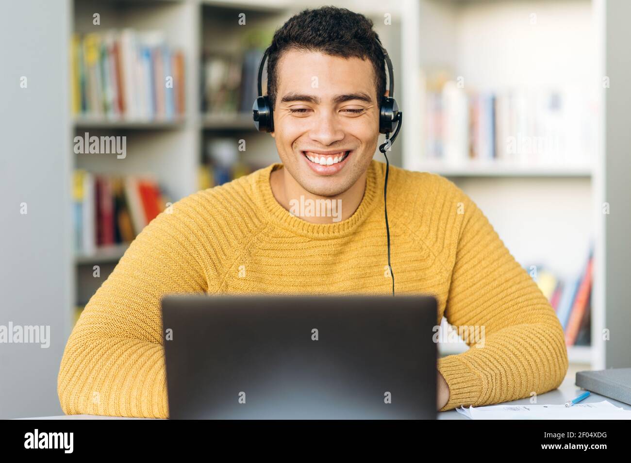 Confident male employee at online video meeting. Handsome smiling ...