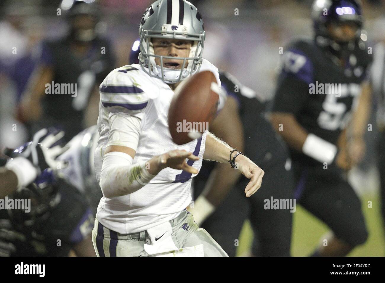 Kansas State quarterback Collin Klein (7) pitches the ball to a running ...