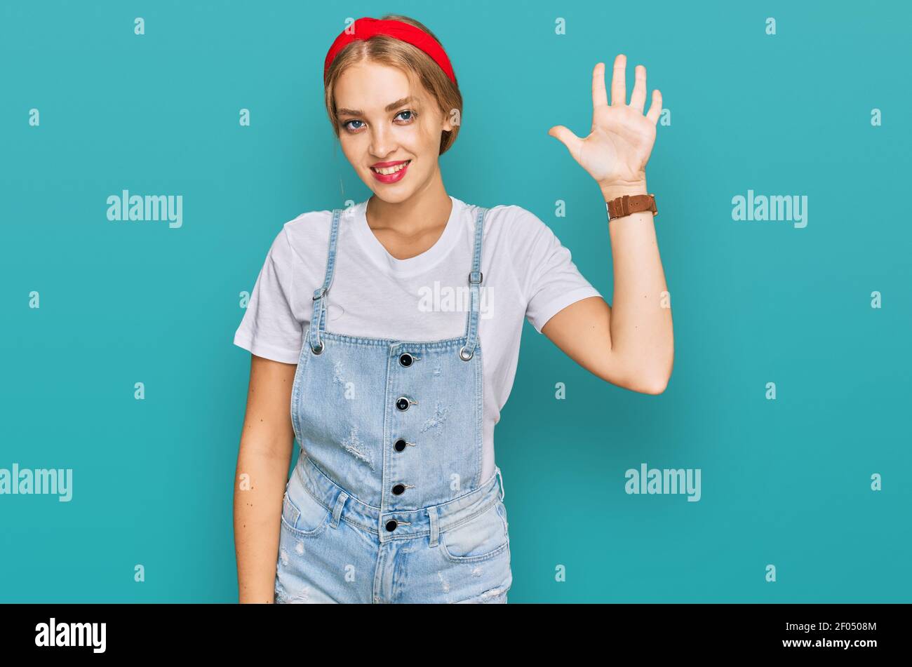 Young caucasian girl wearing casual clothes showing and pointing up ...