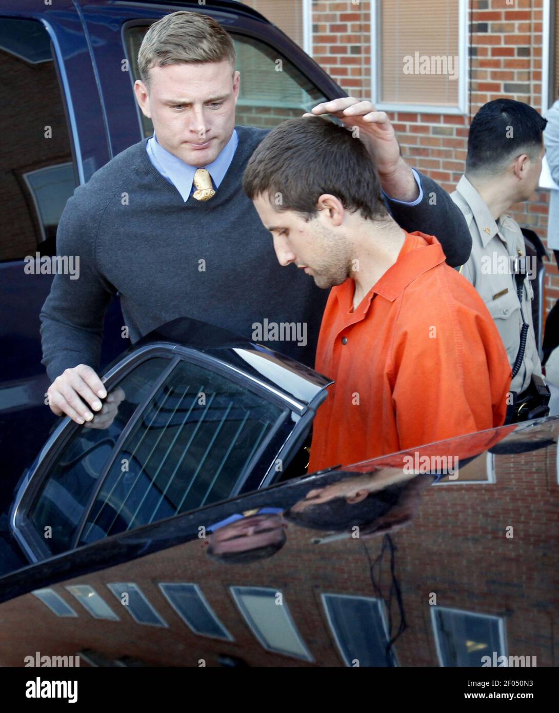 Micah Moore was escorted from the Jackson County Courthouse Annex in ...