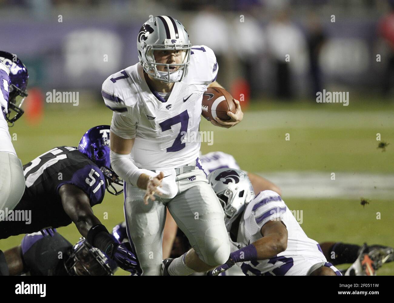 Kansas State quarterback Collin Klein (7) runs for a first-quarter ...