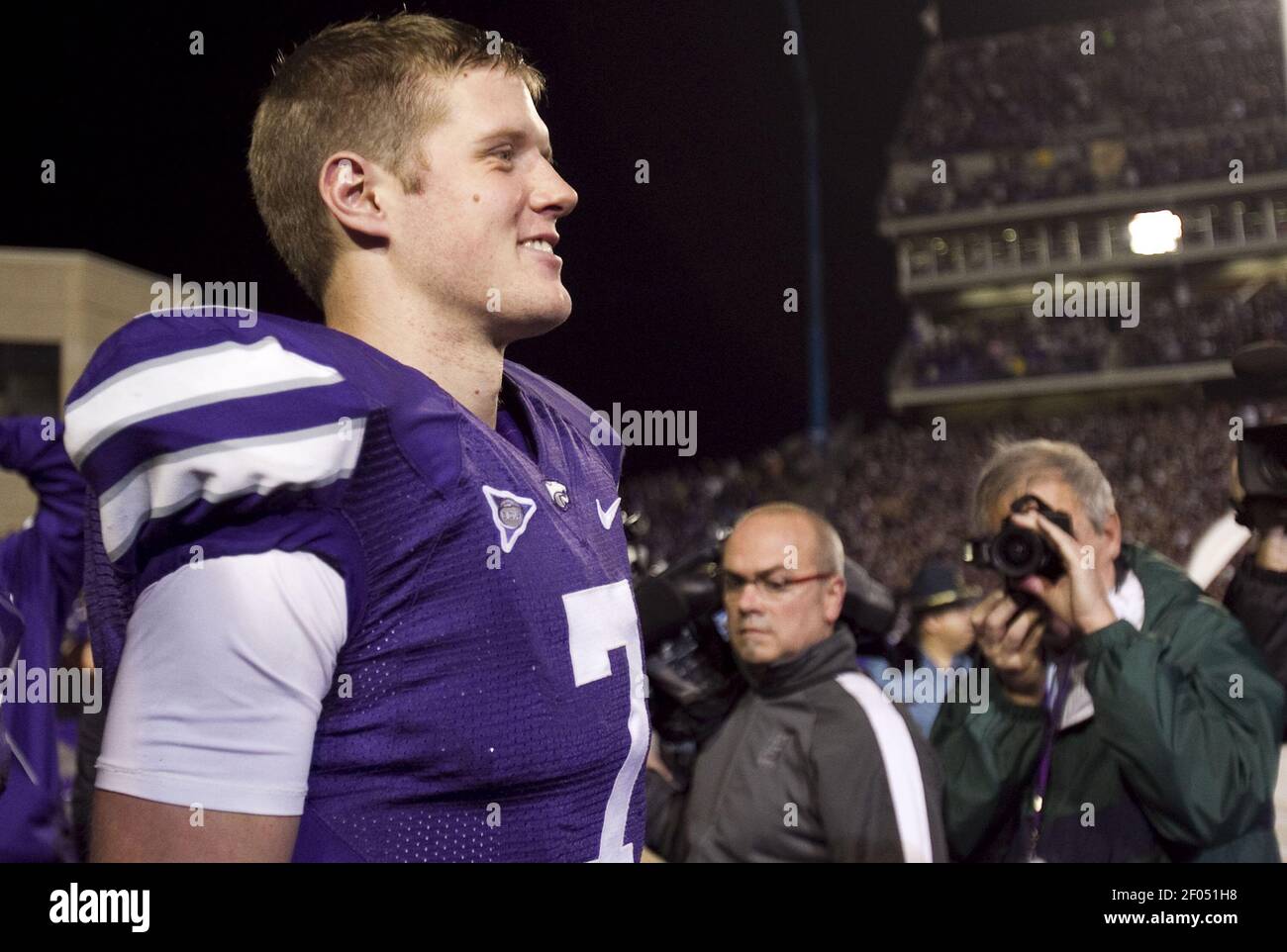 Kansas State quarterback Collin Klein (7) smiles as he takes the field ...