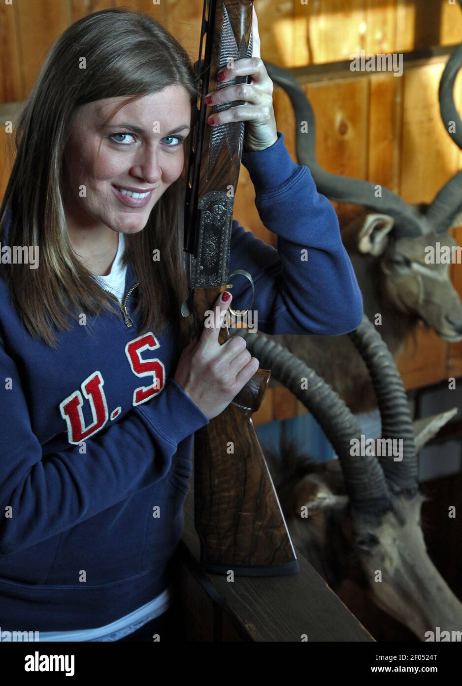 Kelsey Zauhar, 27, a USA Shooting member, holds with her favorite ...
