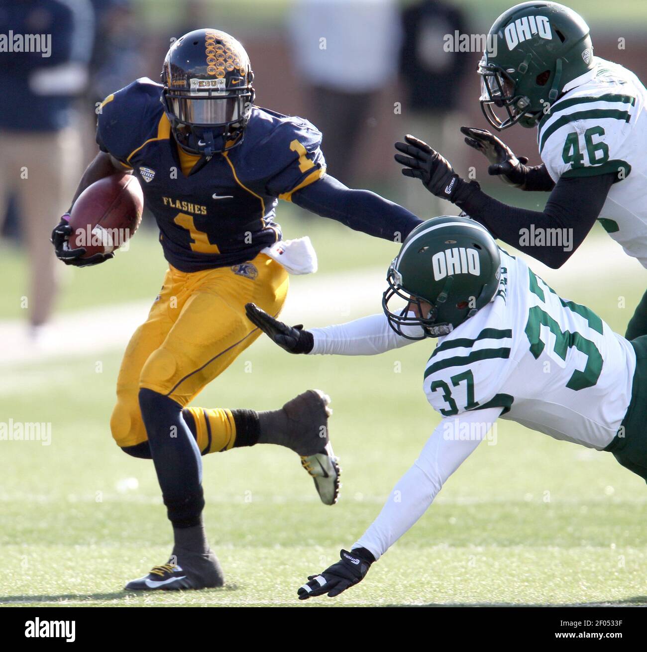 Kent State's Dre Archer (1) gets away from Ohio University's Devin Bass ...