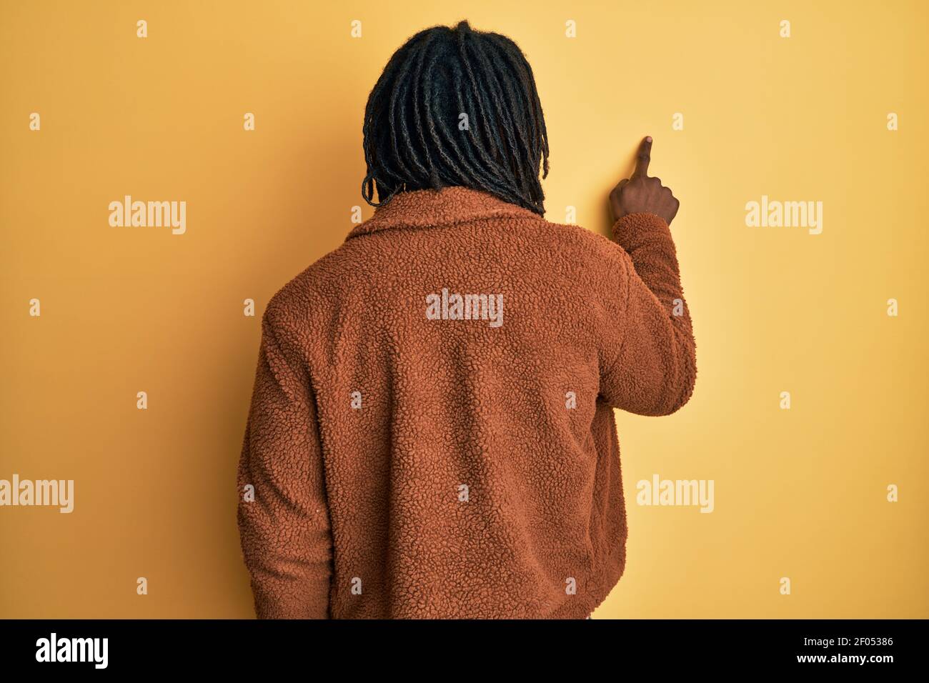 Man black jacket backwards hi-res stock photography and images - Alamy