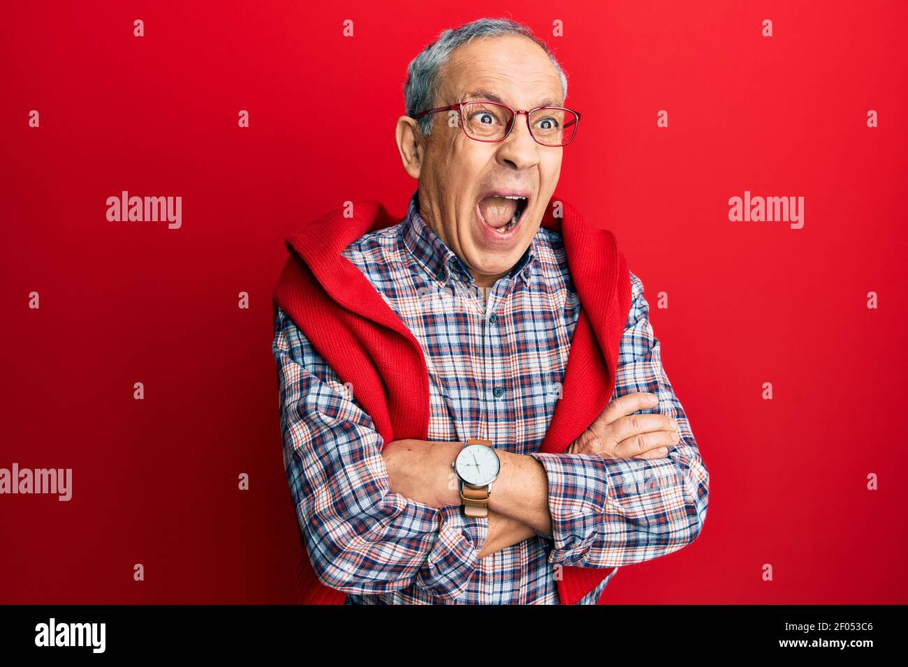 Handsome senior man with grey hair wearing casual clothes and glasses ...