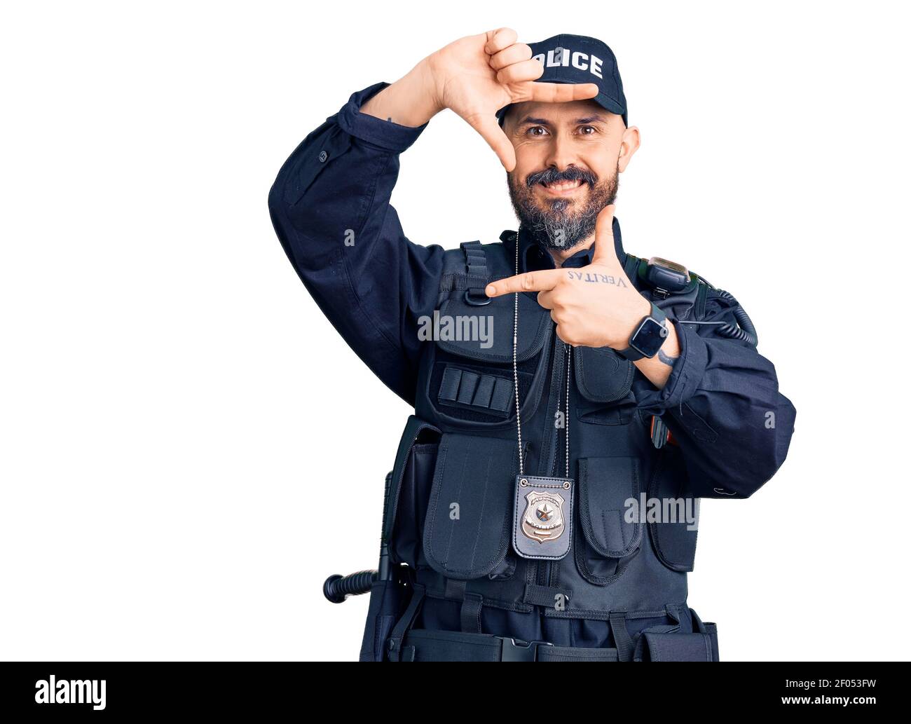 Young handsome man wearing police uniform smiling making frame with ...
