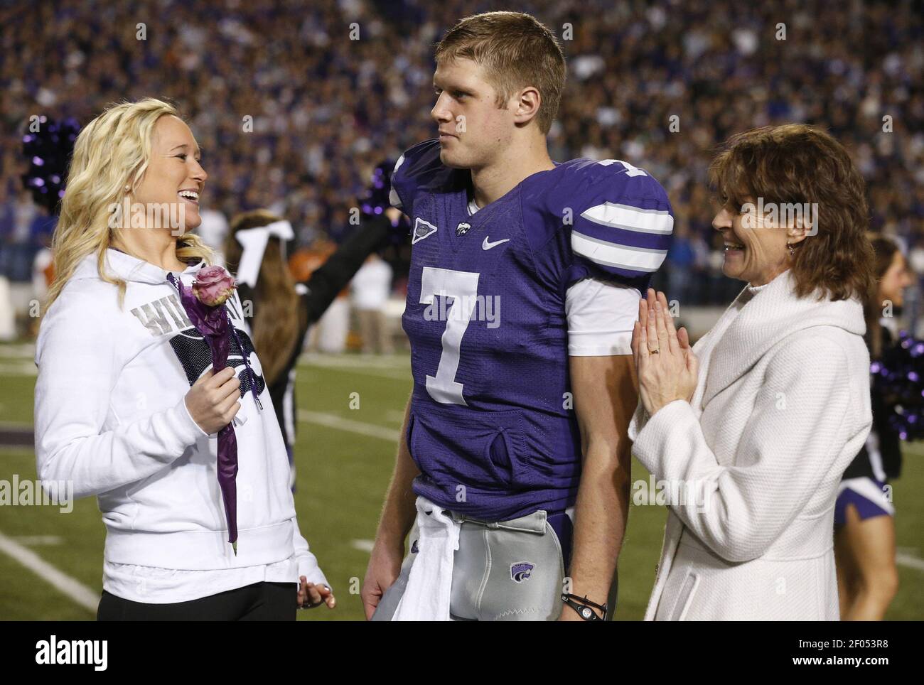 Kansas State quarterback Collin Klein (7) with his wife, Shalin, left ...