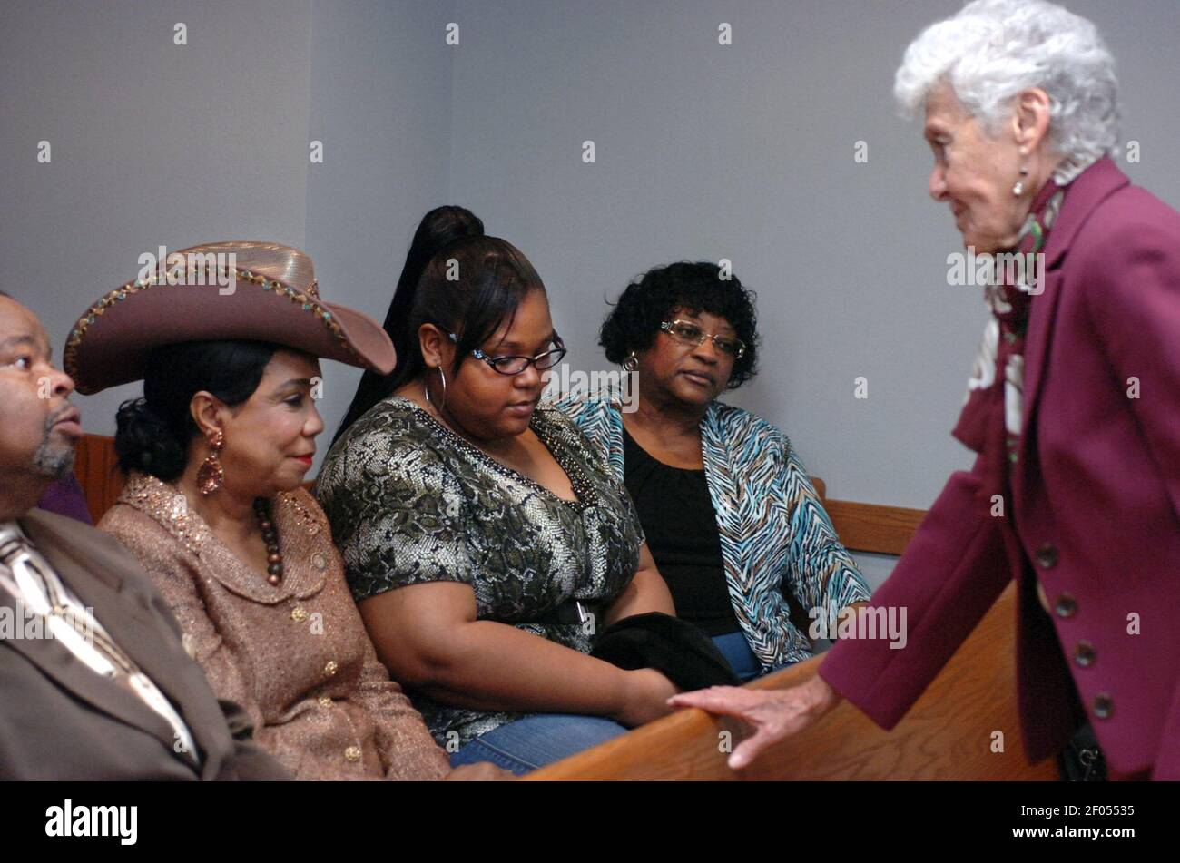 Sally Weintraub, right, a prosecutor, talks with left to right, Rev ...