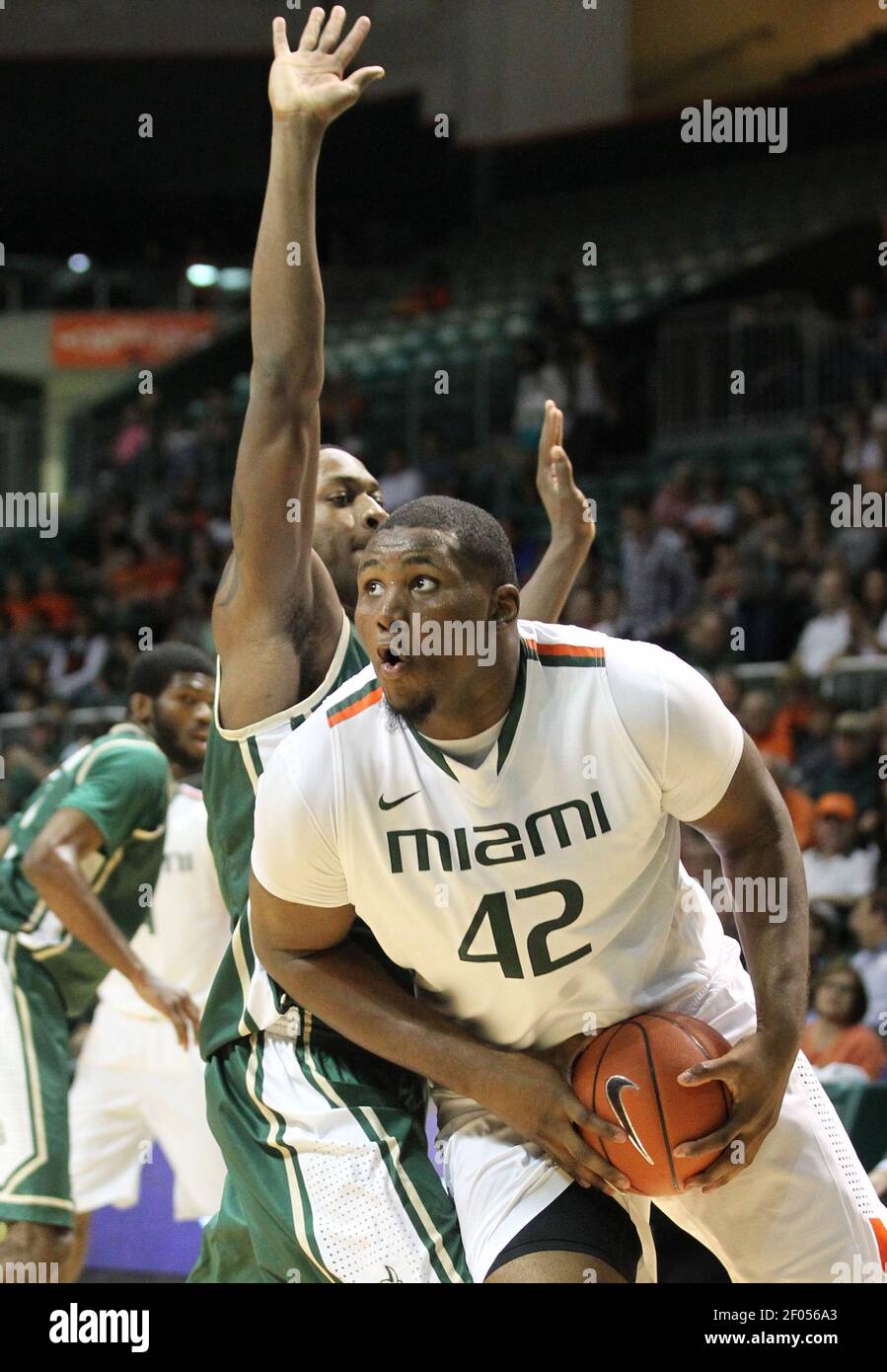 Miami's Reggie Johnson (42) looks to shoot in the first half against ...