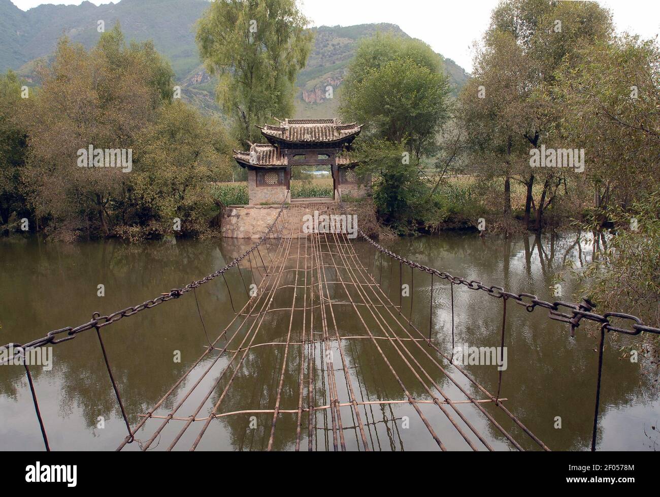 A ROPE BRIDGE AT SONGZHANLIN MONASTERY, ZHONGDIAN, SHANGRI LA, YUNNAN ...