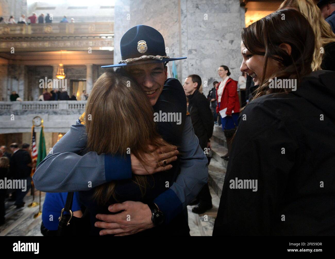Washington State Trooper graduate Erik Rasmussen gets a congratulatory ...