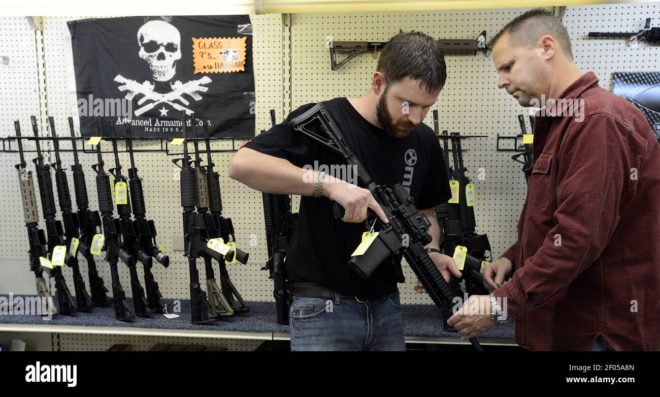 Sales representative Jason Brown, left, shows Steve Levy, of Rolesville ...