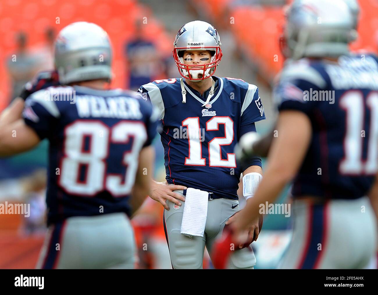 New England Patriots quarterback Tom Brady looks over his receivers ...