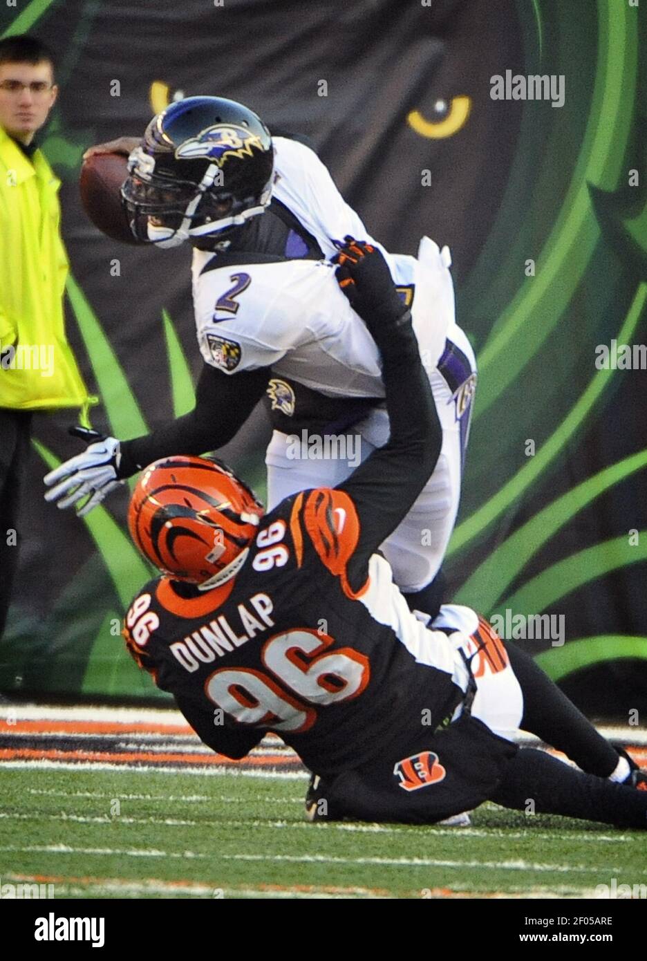 Baltimore Ravens quarterback Tyrod Taylor (2), top, is sacked by ...