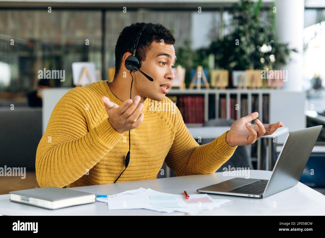 Young guy talks on conference hi-res stock photography and images - Alamy