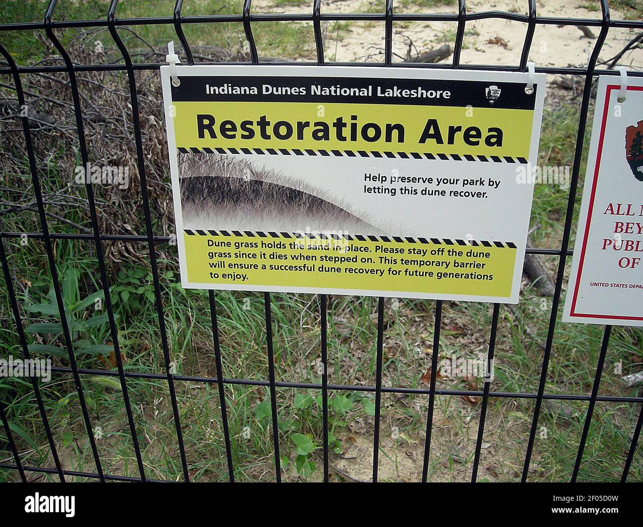 A sign warns park visitors that sections of the dunes are closed to ...