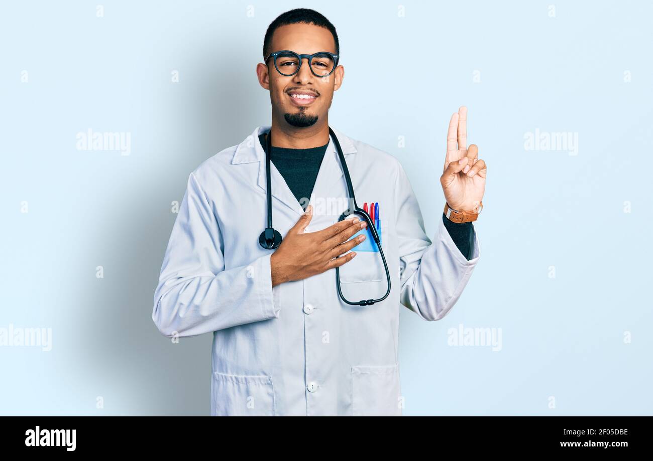 Young african american man wearing doctor uniform and stethoscope ...