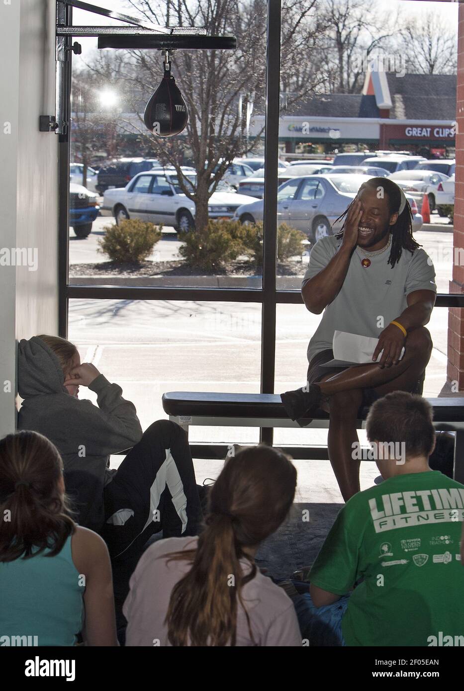DeVon Glover, of Overland Park, Kansas, laughs as he tells stories ...