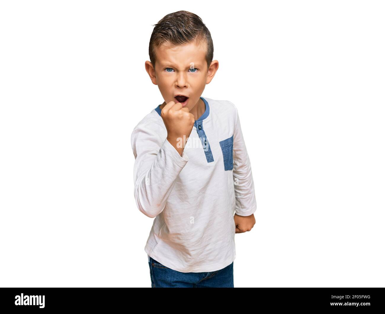 Adorable caucasian kid wearing casual clothes angry and mad raising ...