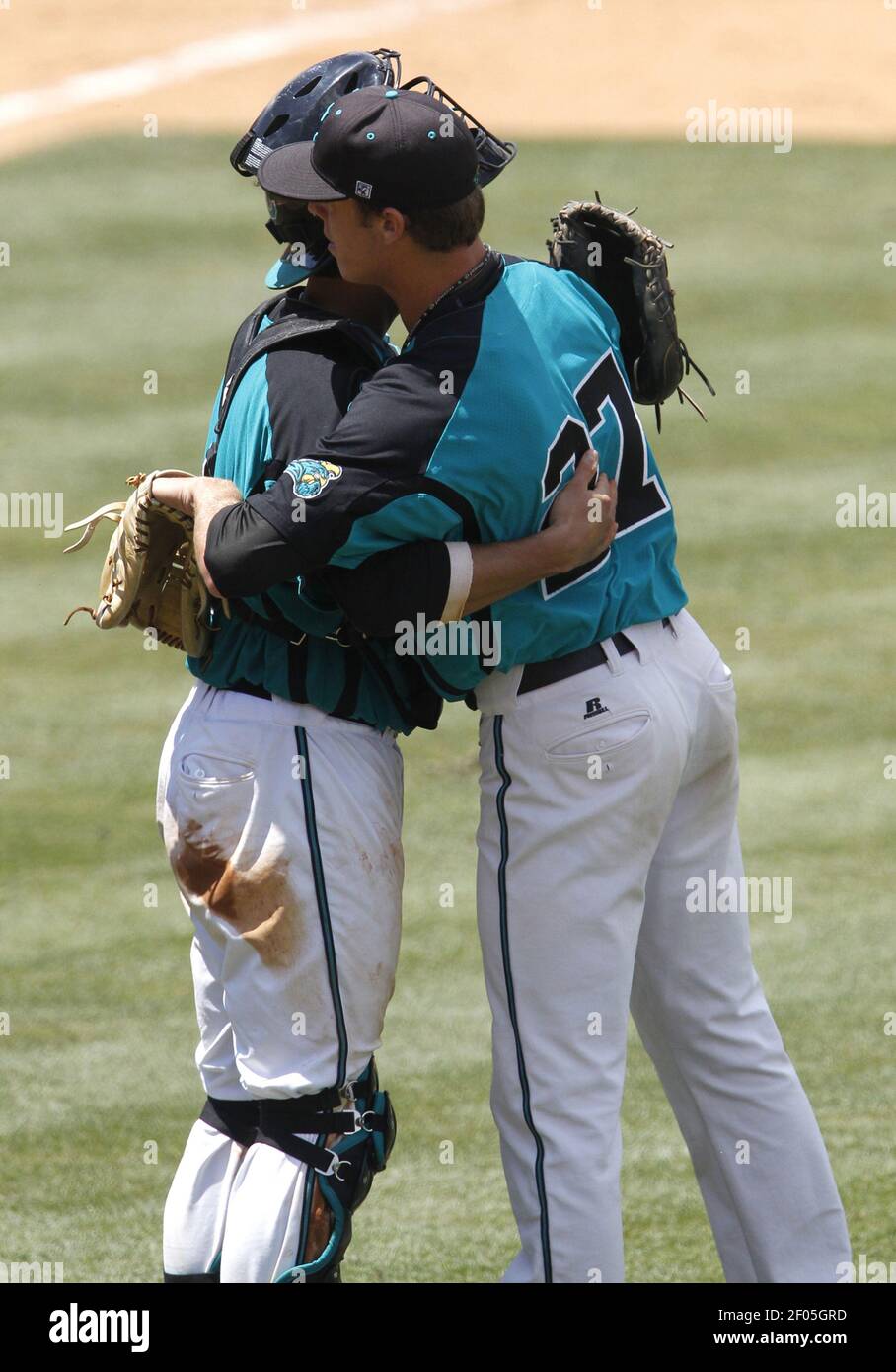 Coastal Carolina pitcher Tyler Herb embraces catcher Tucker Frawley ...