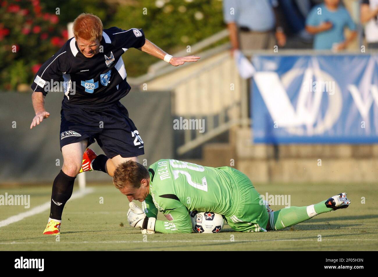 Chivas USA's Timothy Melia (28) blocks a shot by Carolina RailHawks ...