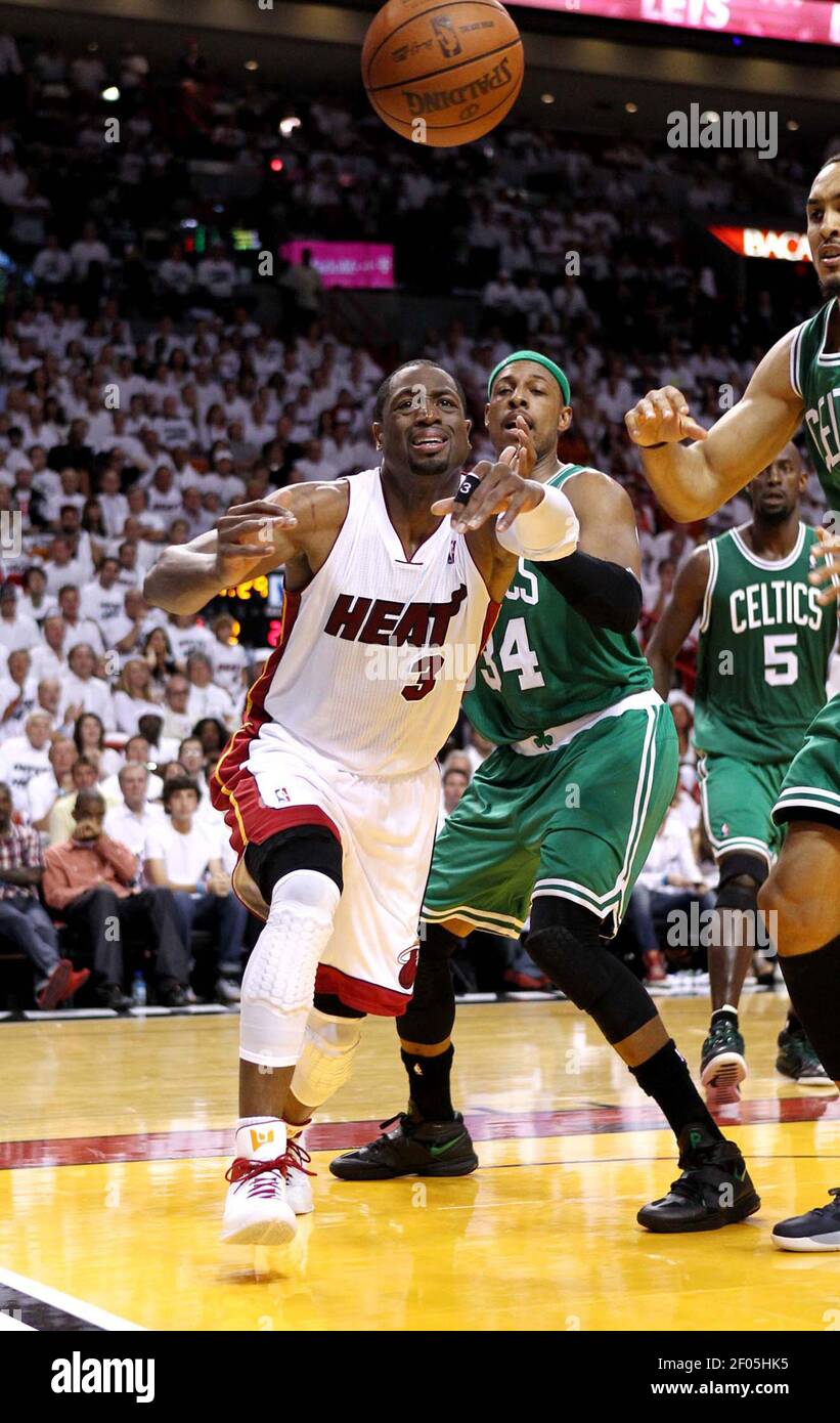 The Miami Heat's Dwyane Wade (3) attempts to drive around the Boston ...