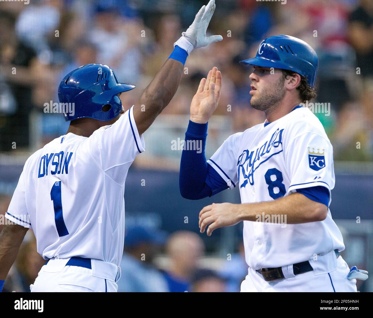 Kansas City Royals' Mike Moustakas (8) is greeted by Jarrod Dyson (1 ...