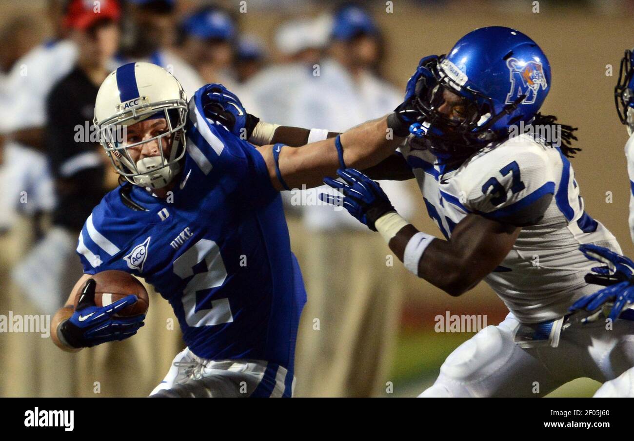 Duke wide receiver Conner Vernon (2) stiff arms Memphis defensive back ...