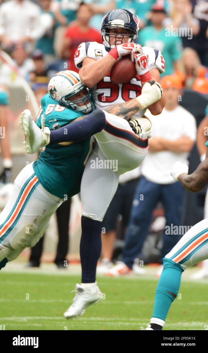 Brian Cushing (56) of the Houston Texans pulls in an interception and ...