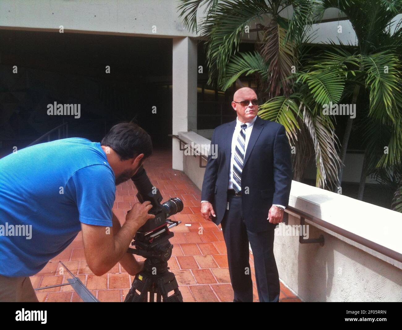 "The First 48" cameraman frames a shot of Miami Homicide Detective ...
