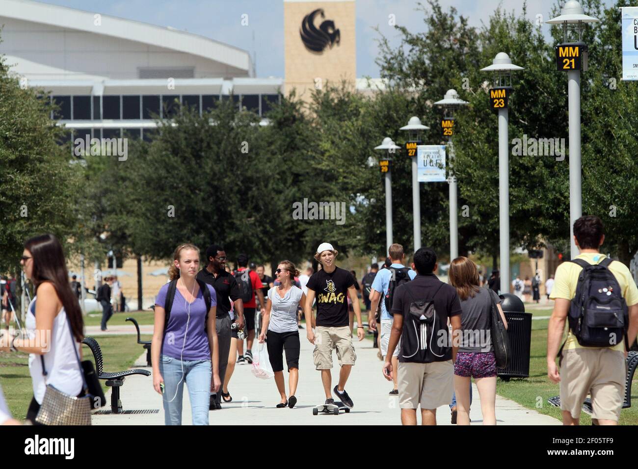 Students walk on the Memory Mall area of UCF's campus in this file ...