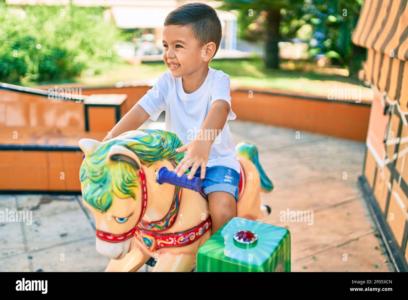 Adorable hispanic boy smiling happy playing at the park Stock Photo - Alamy