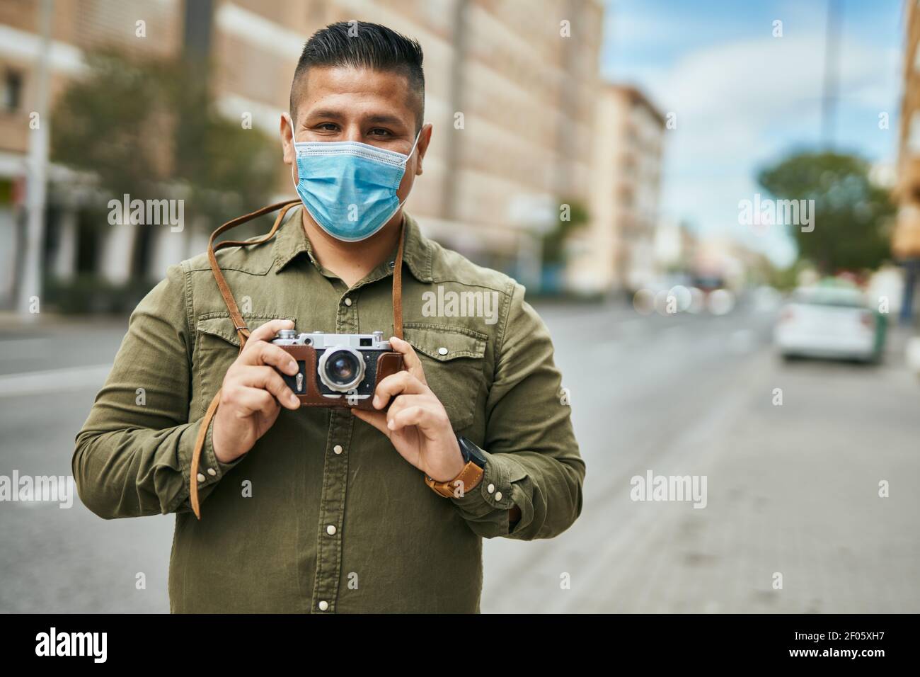 Latin young man mask walking hi-res stock photography and images - Alamy
