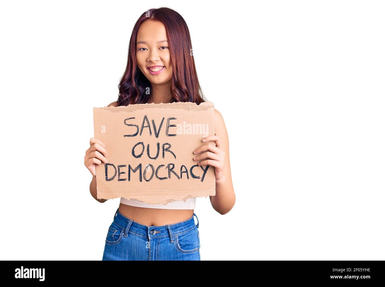 Young beautiful chinese girl holding save our democracy protest banner ...