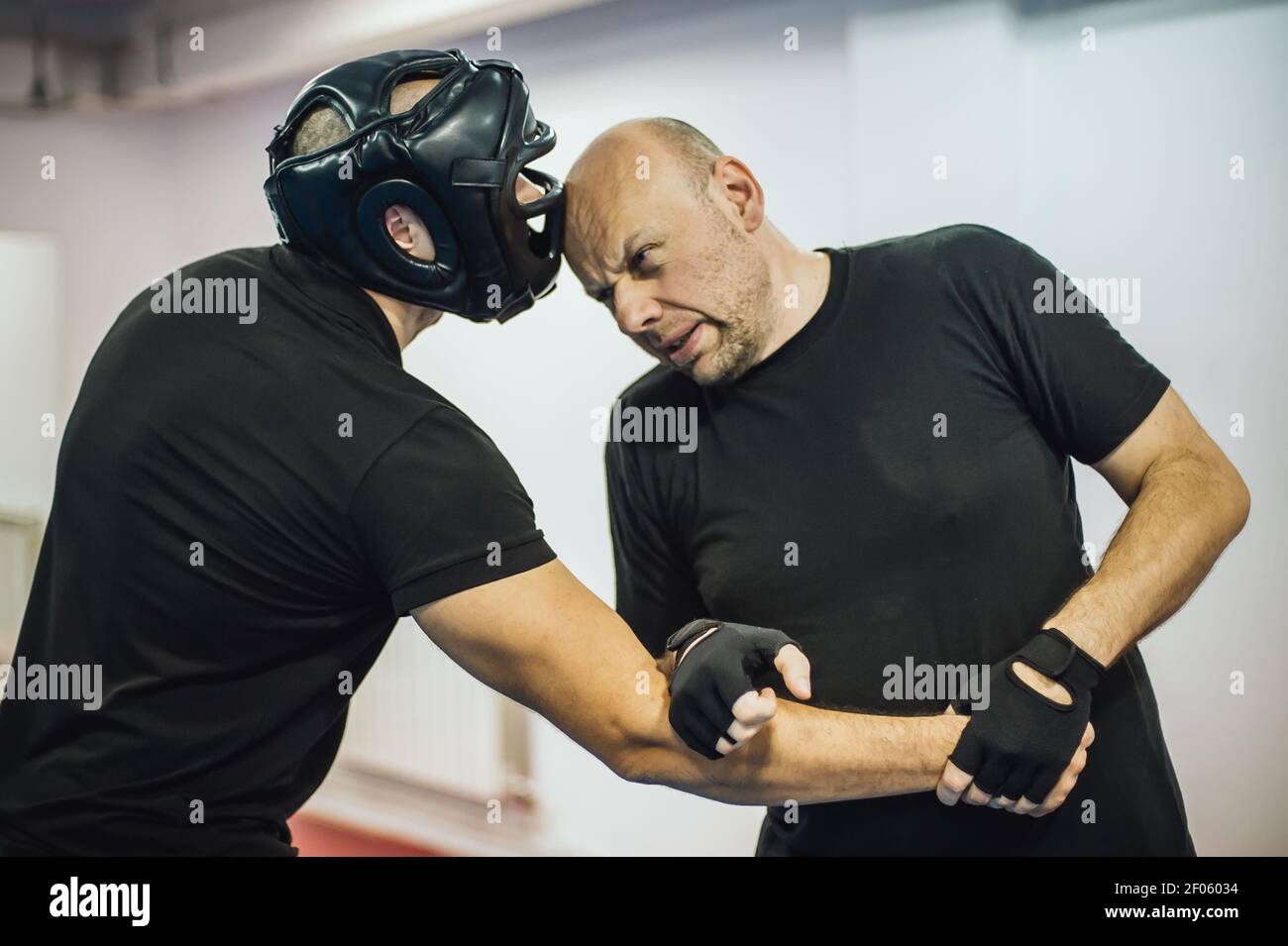 Instructor demonstrate headbutt street fight technique against attacker ...