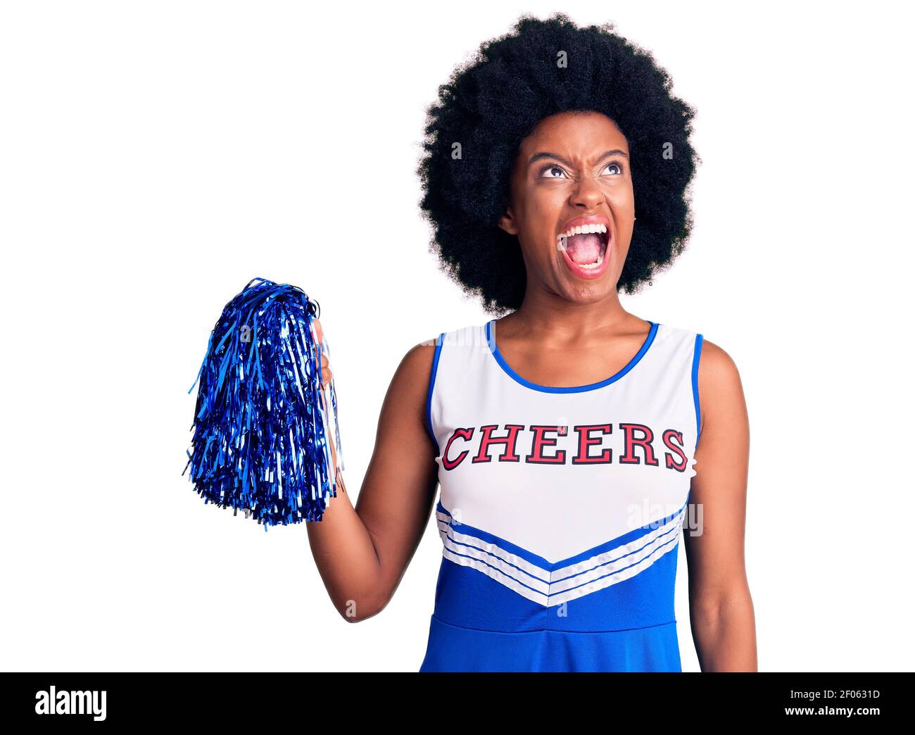 Young african american woman wearing cheerleader uniform holding pompom ...
