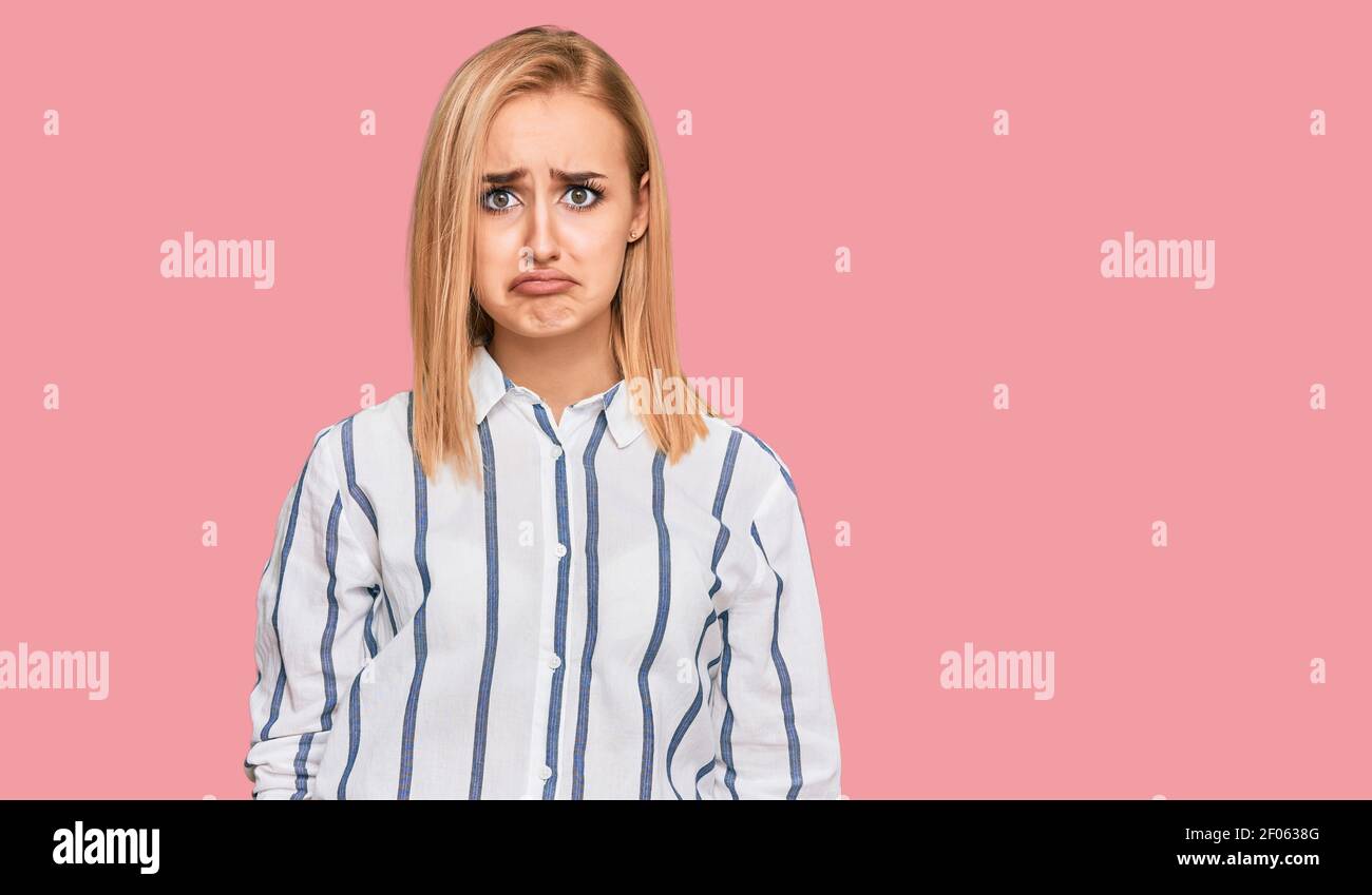 Beautiful caucasian woman wearing casual clothes depressed and worry ...