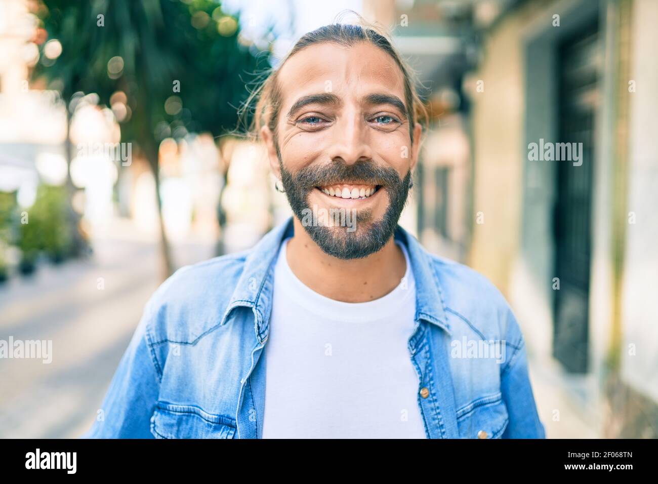 Young middle eastern man smiling happy walking at the city Stock Photo ...