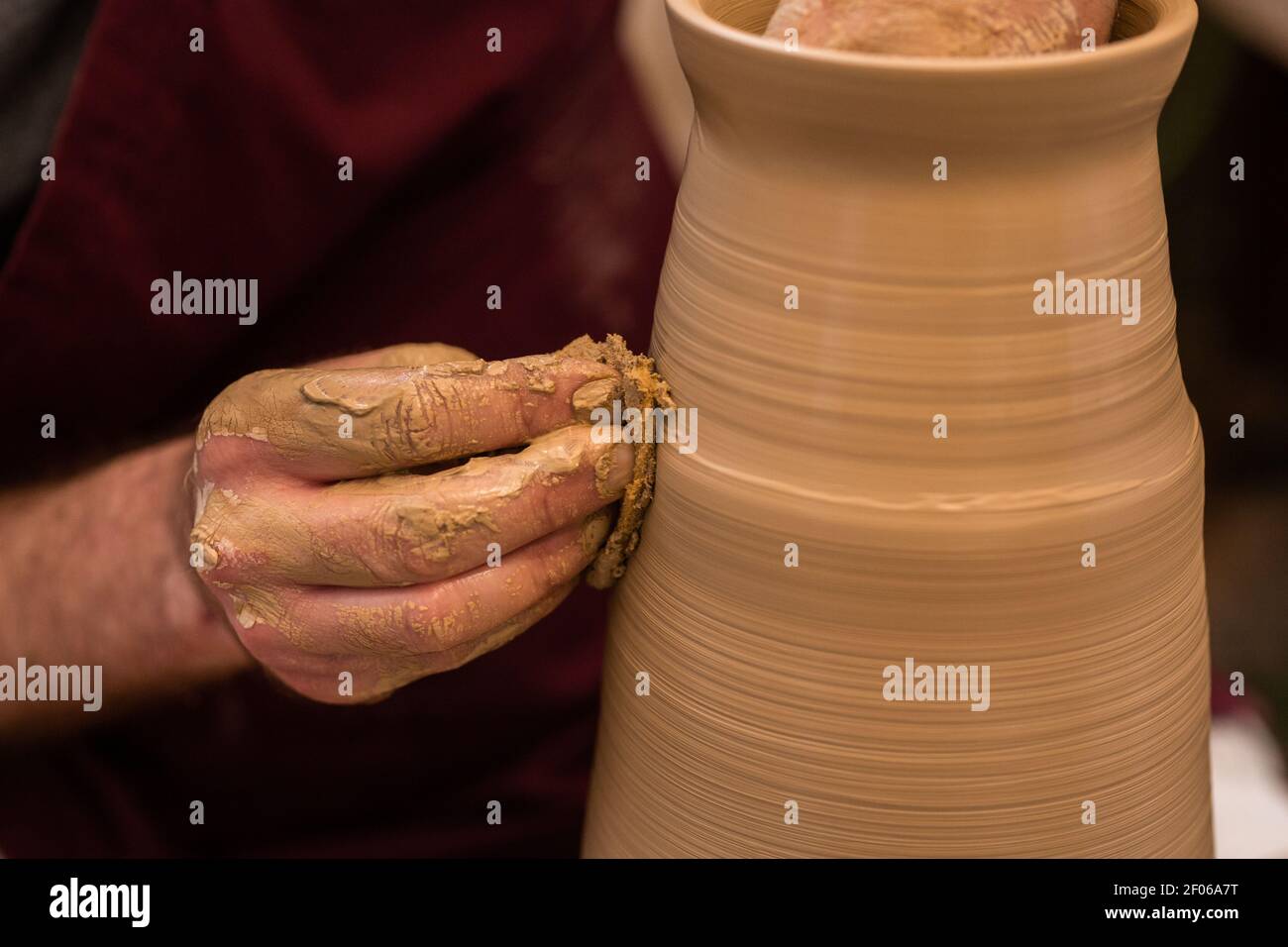 Crop unrecognizable sculptor with equipment giving shape while ...