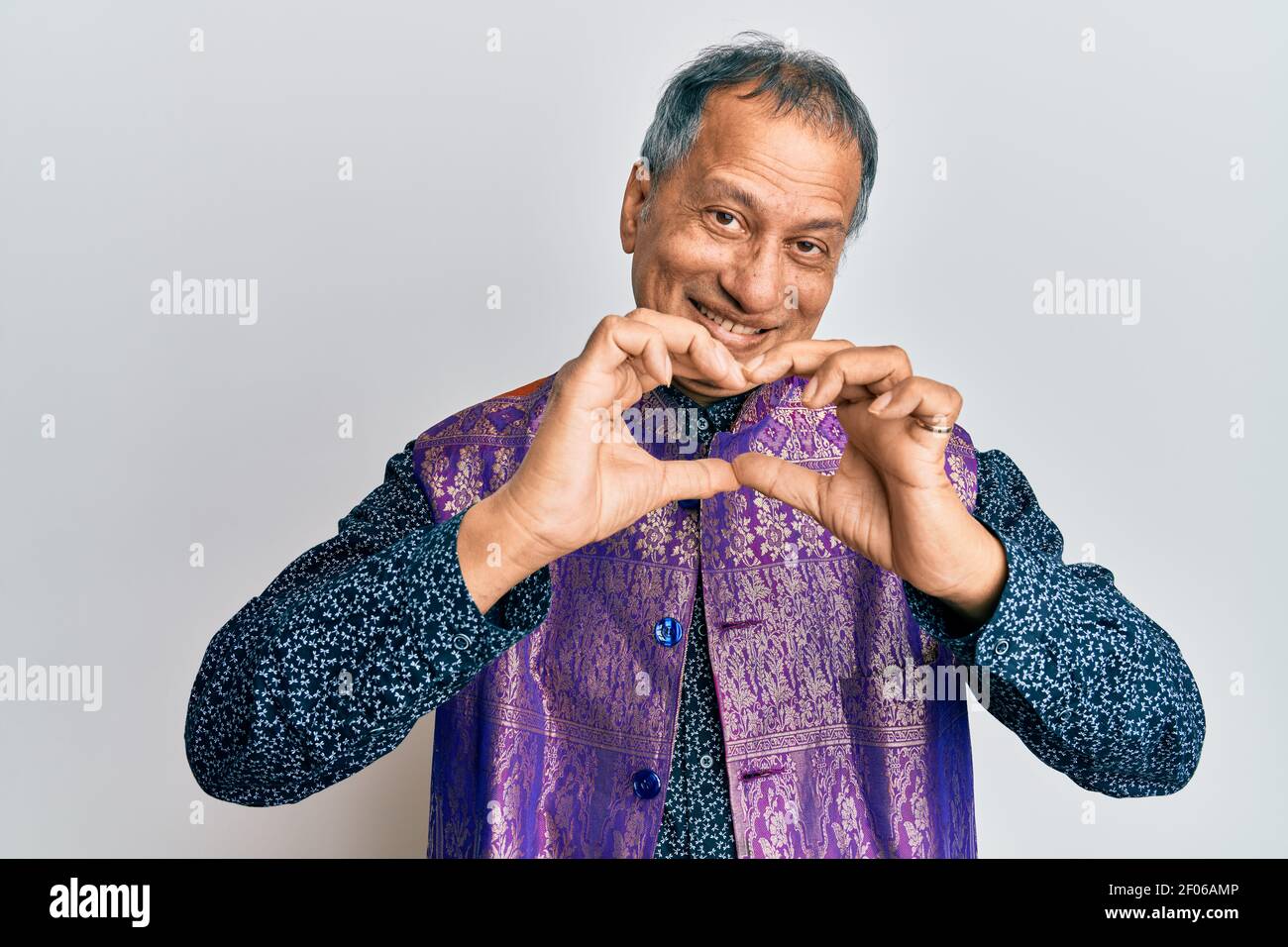 Middle age indian man wearing traditional indian clothes smiling in ...