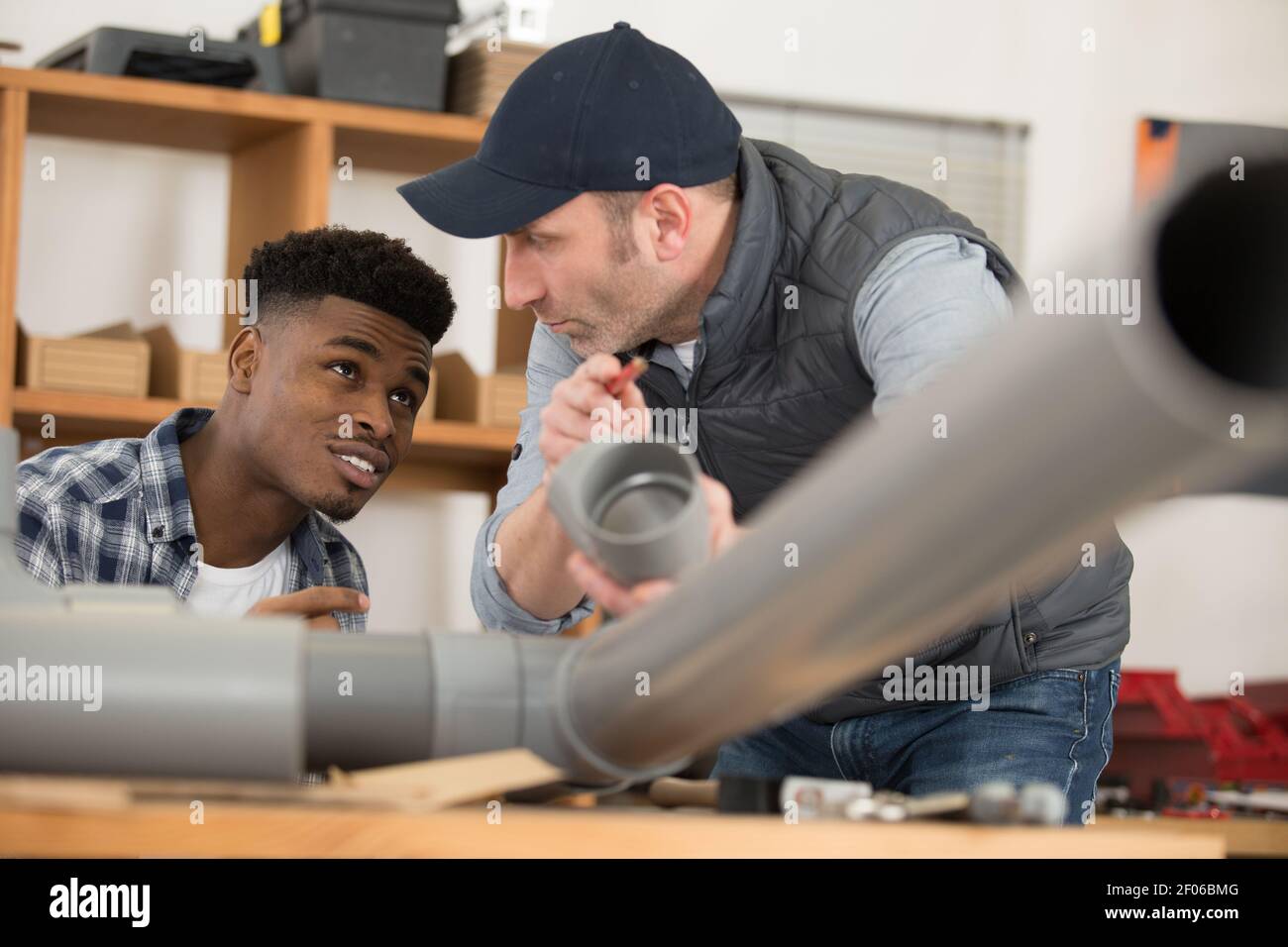 plumbers fitting pvc pipes together Stock Photo - Alamy