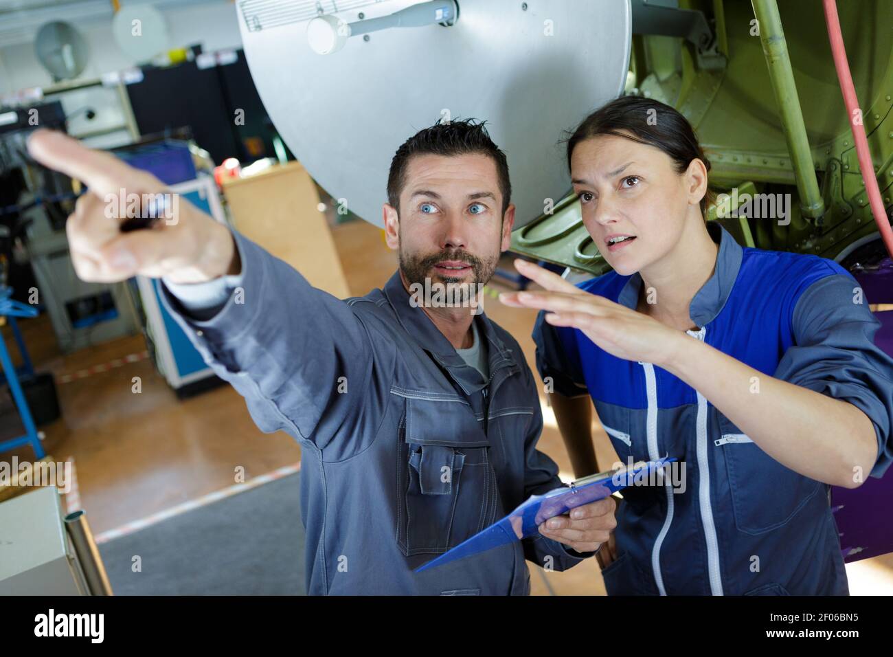 aircraft manufacturing workers observing something Stock Photo - Alamy