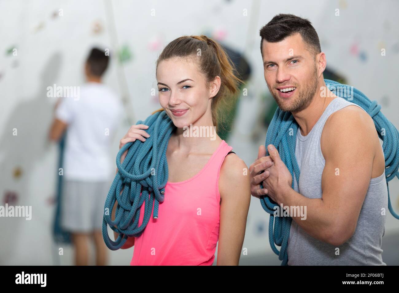 portrait of couple holding climbing ropes Stock Photo - Alamy