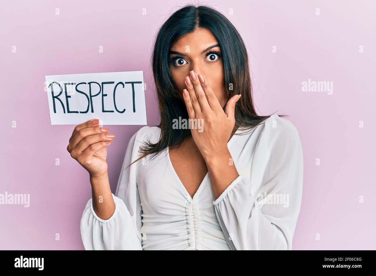 Young latin transsexual transgender woman holding respect message paper ...